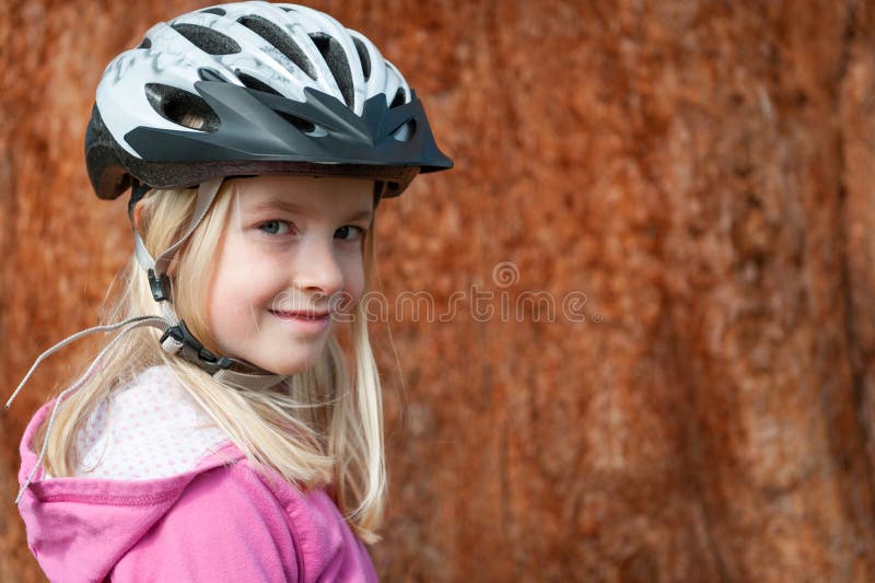 A Young Blonde Girl Poses in a Cycle Helmet Stock Image - Image of ...
