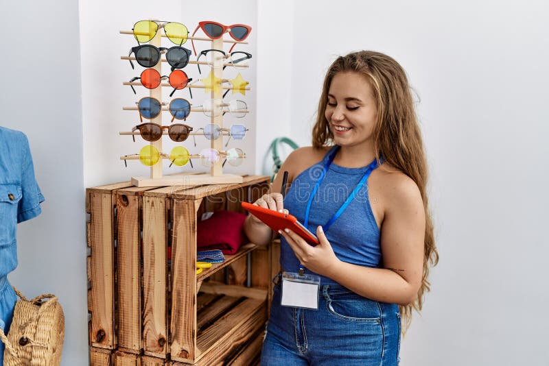 Young Blonde Girl Using Touchpad Working at Clothing Store Stock Image ...