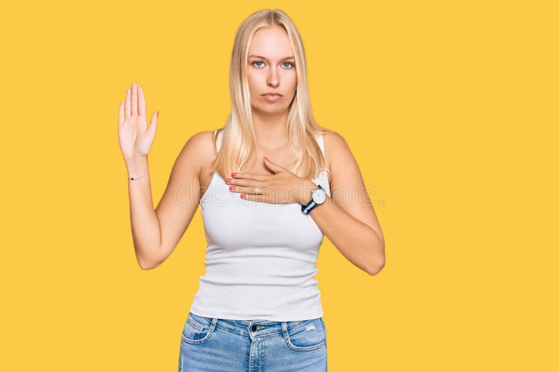 Young Blonde Girl Wearing Casual Style With Sleeveless Shirt Swearing