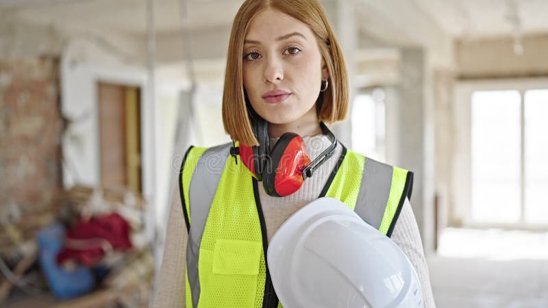 Young Blonde Woman Architect Standing with Relaxed Expression Holding ...