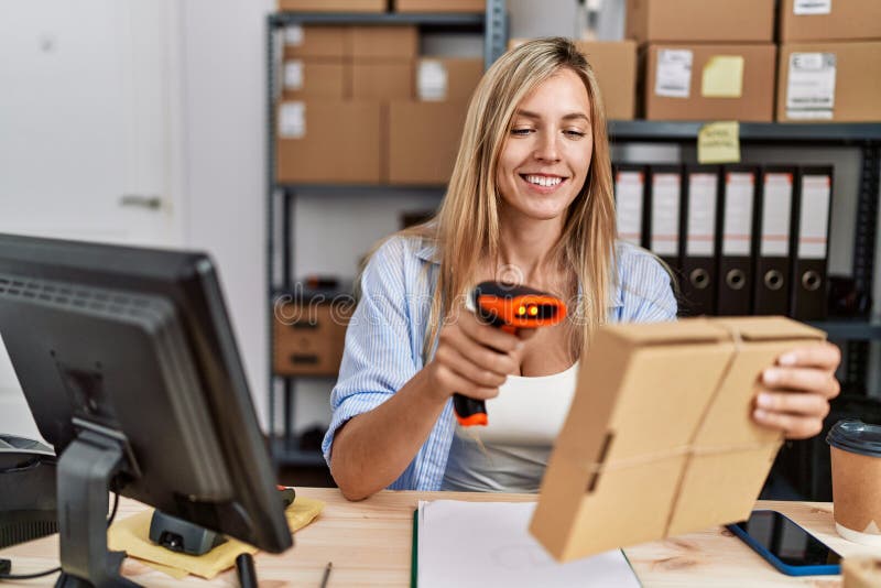 Young Blonde Woman Ecommerce Business Worker Scanning Package Using ...