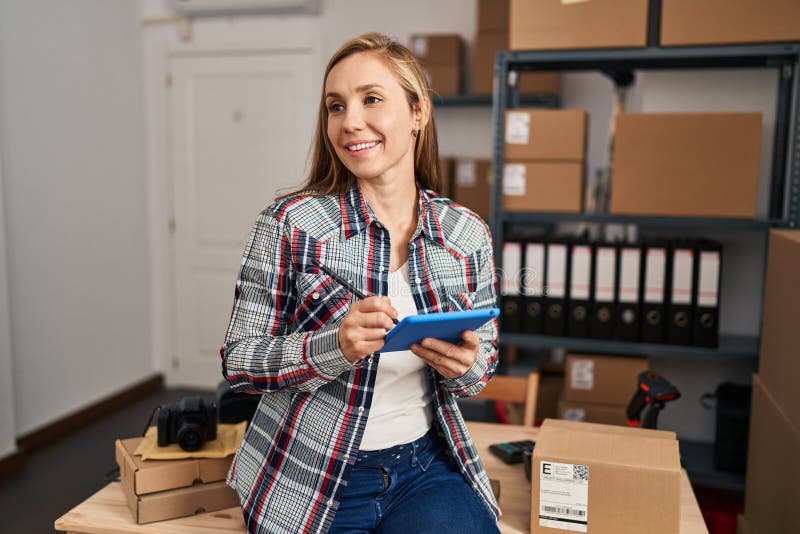 Young Blonde Woman Ecommerce Business Worker Using Touchpad at Office ...