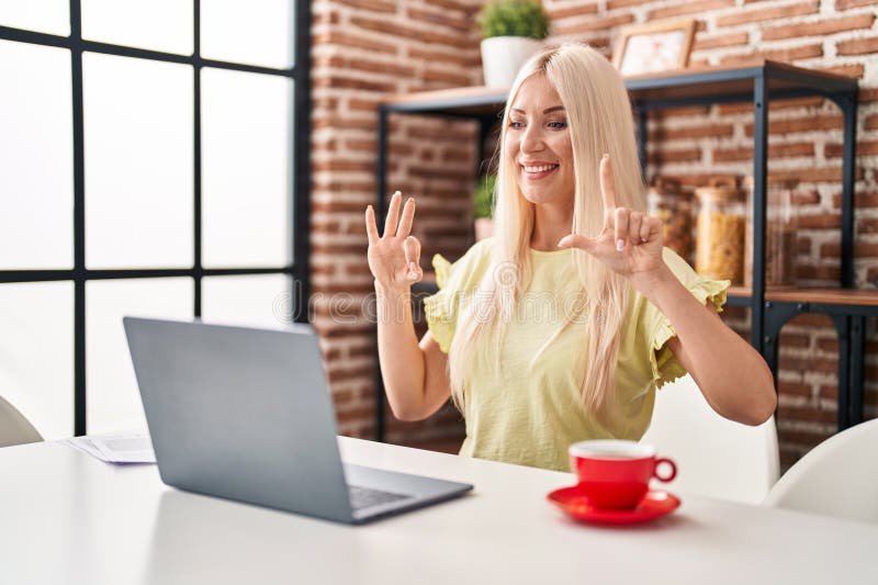 Young Blonde Woman Having Video Call Using Deaf Language at Home Stock ...
