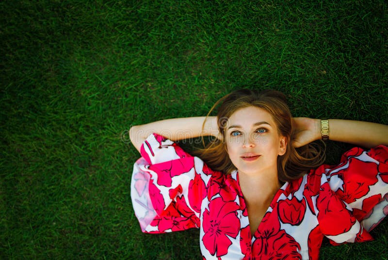 Young Blonde Woman Lies On The Grass Fresh Natural Summer Concept