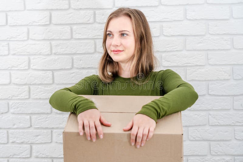 Young Blonde Woman with Parcel Box. Delivering a Parcel Stock Image ...