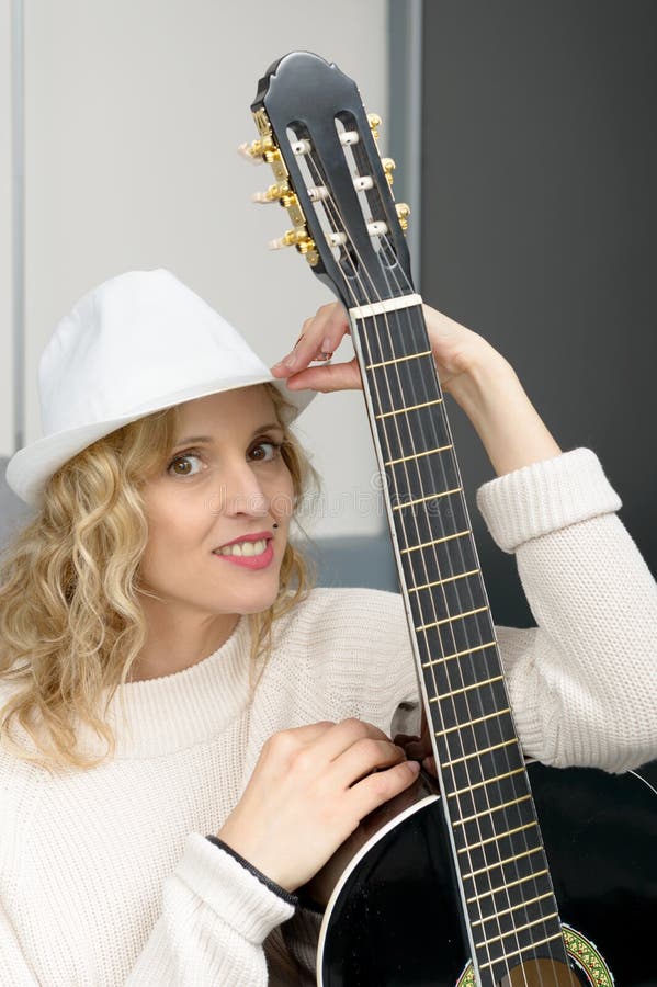 Young Blonde Woman Playing the Acoustic Guitar Stock Photo - Image of ... Young Blonde Woman Playing the Acoustic Guitar Stock Photo - Image of ...