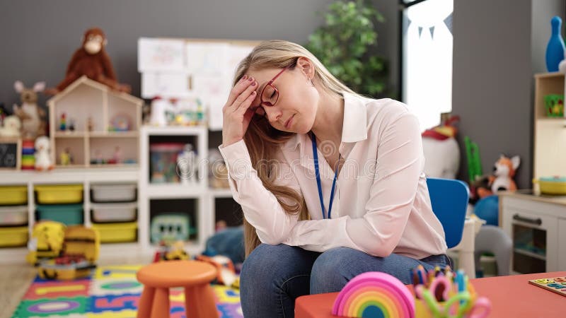 Young Blonde Woman Preschool Teacher Standing with Relaxed Expression ...