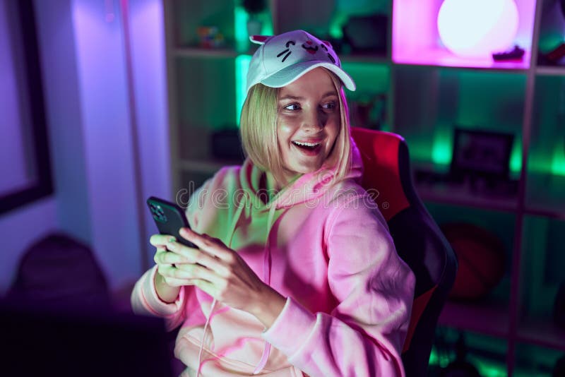 Young Blonde Woman Streamer Using Smartphone at Gaming Room Stock Image ...