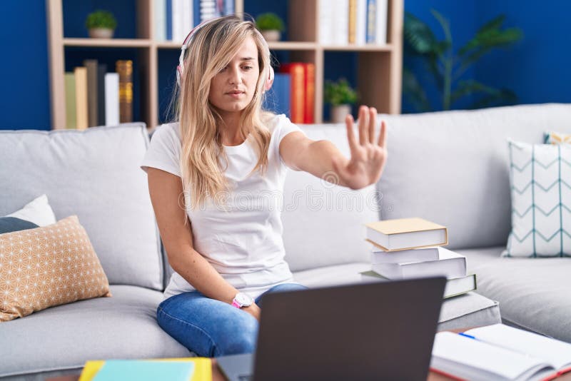 Young Blonde Woman Studying Using Computer Laptop at Home Doing Stop ...