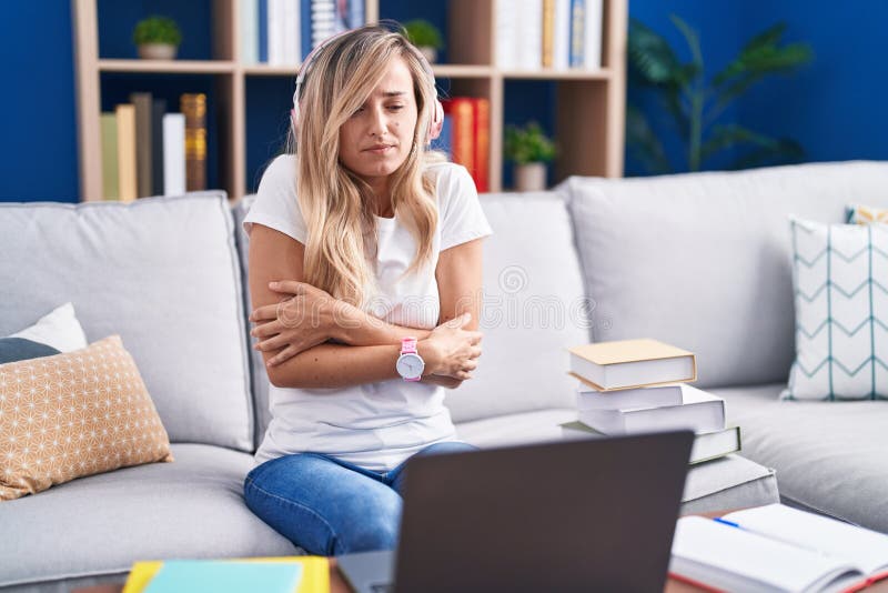 Young Blonde Woman Studying Using Computer Laptop at Home Shaking and ...