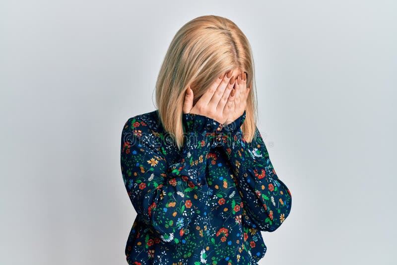 Young Blonde Woman Wearing Casual Clothes With Sad Expression Covering