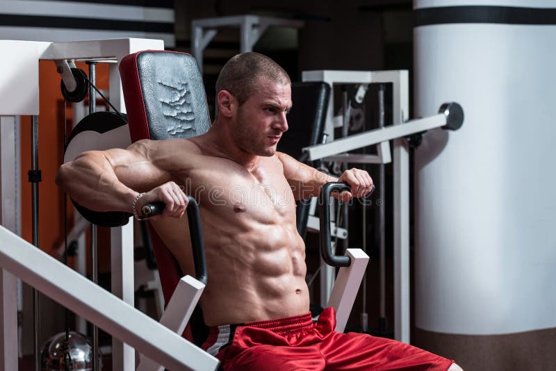 Young Bodybuilder Doing Heavy Weight Exercise for Chest Stock Photo ...