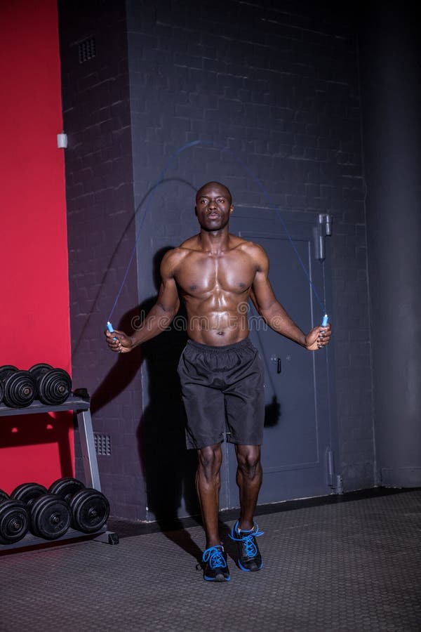 Young Bodybuilder Doing Jumps Over a Rope Stock Image - Image of ...