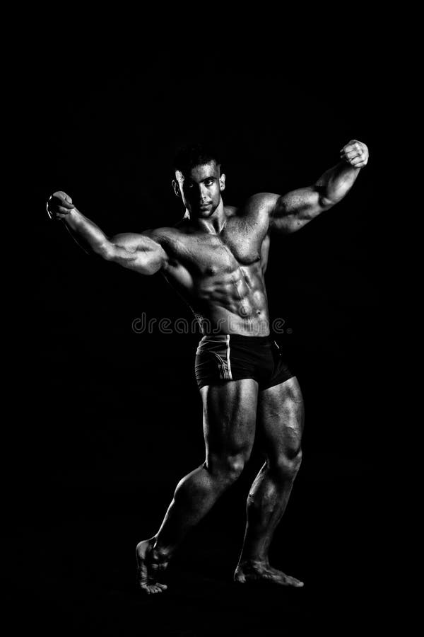Young bodybuilder posing stock photo. Image of competition - 30873950