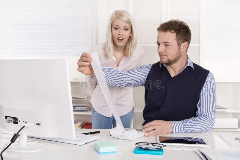 Young Bookkeeper Working with His Female Assistant at Office. Stock ...