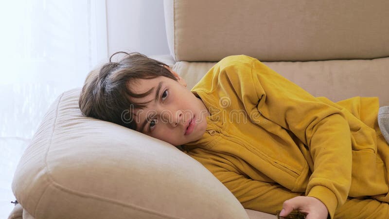 Young Bored Boy Watching Tv Stock Photo - Image of irritation, remote ...