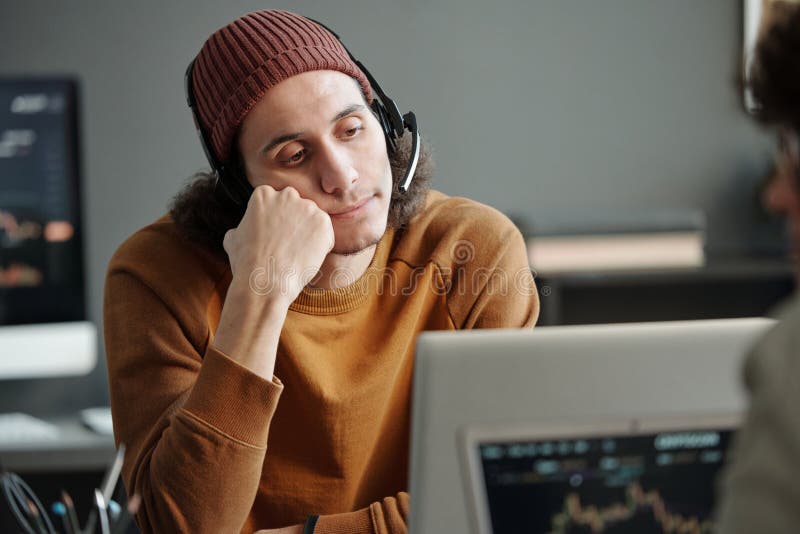 Young Bored Operator of Call Center Sitting in Front of Laptop Screen ...