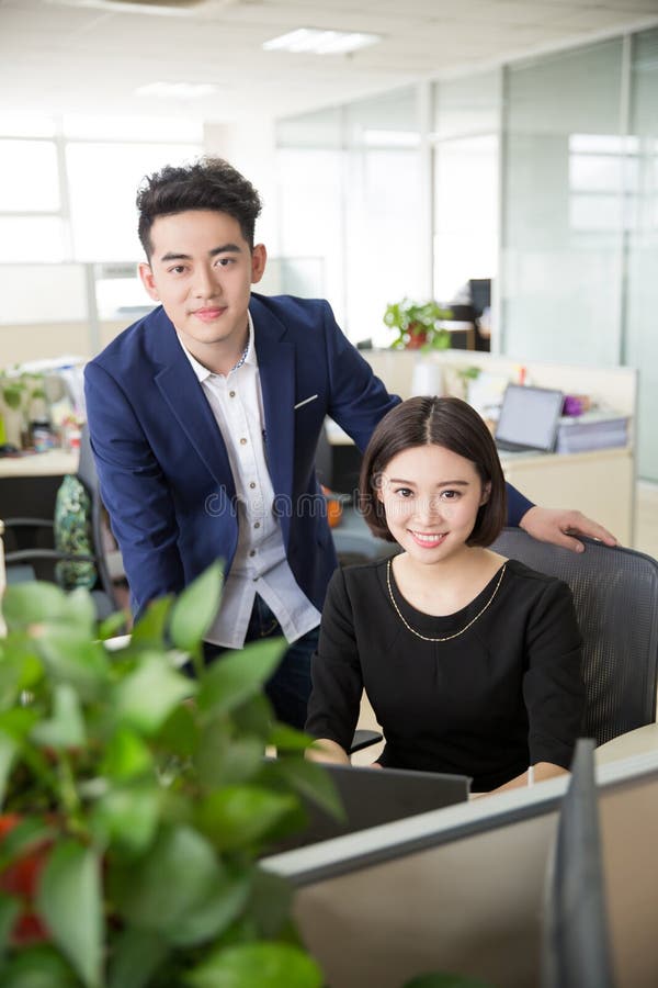 Young Boss and Assistant at Work Stock Photo - Image of blue, green ...