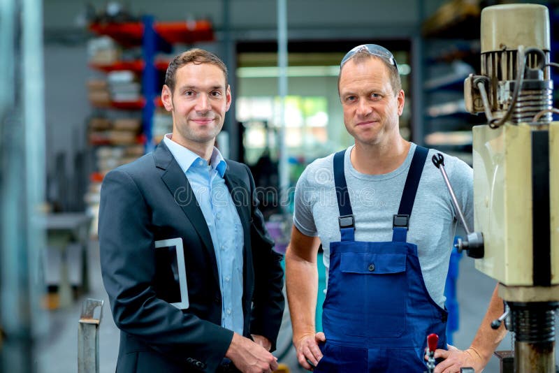 Young Boss and Worker in the Factory Stock Image - Image of caucasian ...