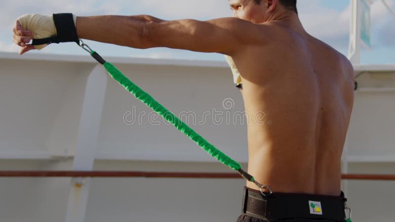 Young Boxer Starts Box Workout with Resistance Band Training Strap ...