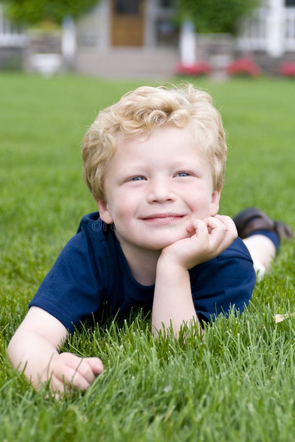 Young Boy stock photo. Image of lawn, school, young, grass - 8836934