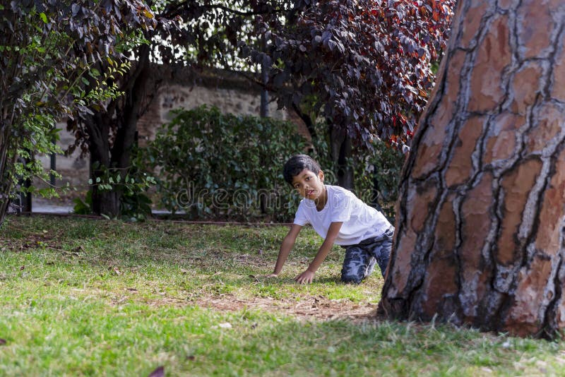 Young Boy Alone. Having Fun in a Park. Stock Image - Image of young ...