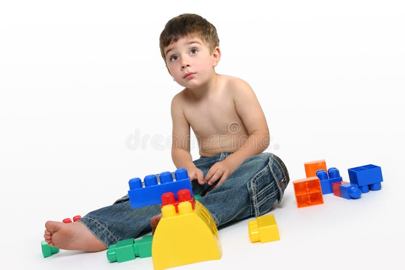 Young Boy Amongst Building Blocks Stock Photo - Image of playtime ...