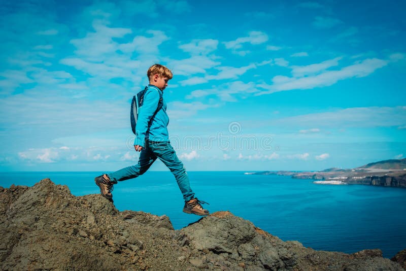 Young Boy With Backpack Hiking In Mountains At Sea Stock Image - Image ...