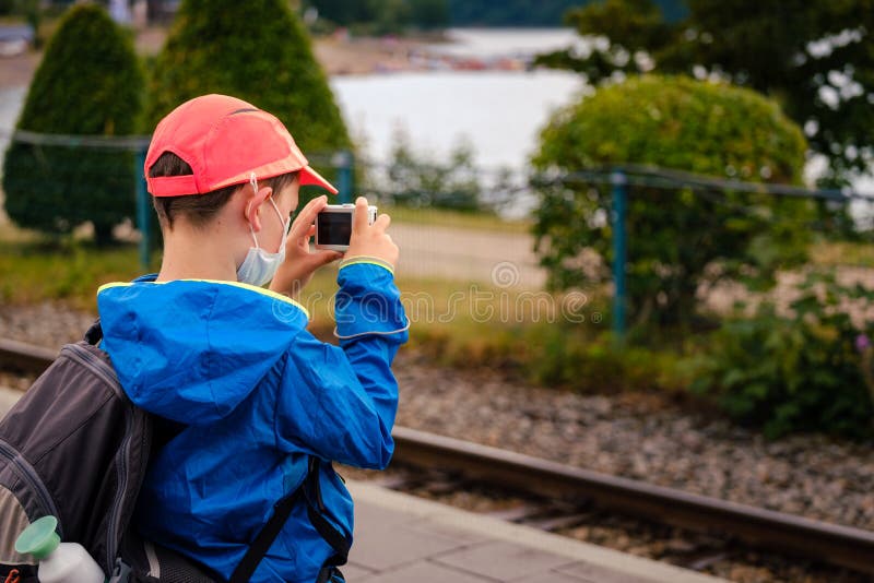 Young Boy with Backpack Taking Picture Stock Photo - Image of taking ...
