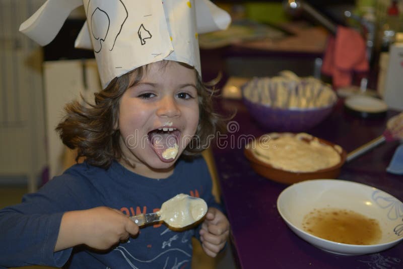 Young Boy Baking a Cake at Home Stock Photo - Image of fresh, laughing ...