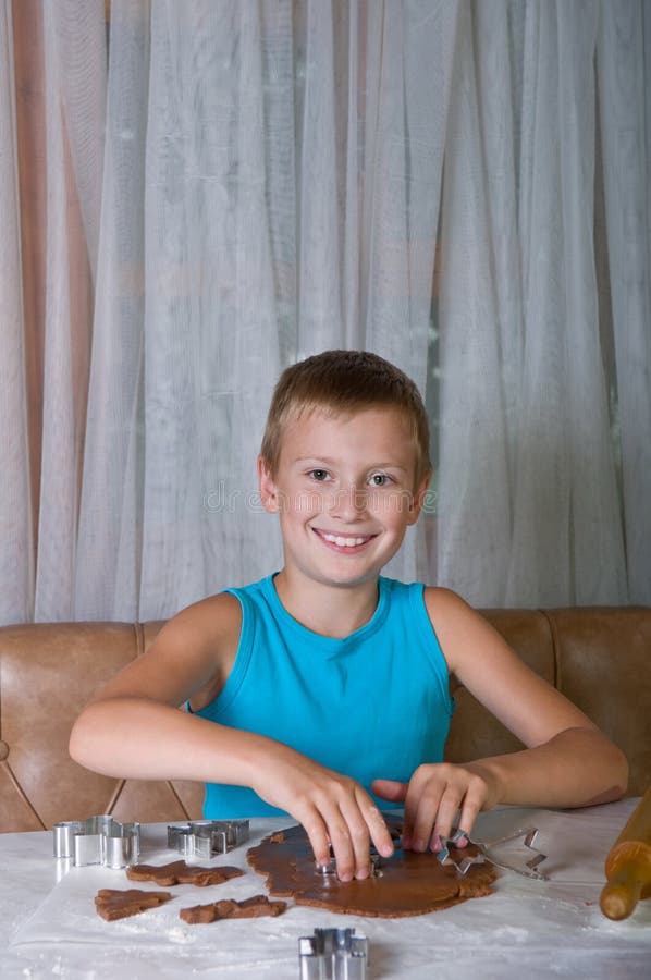 Young boy baking cookies stock image. Image of gingerbread - 26226949