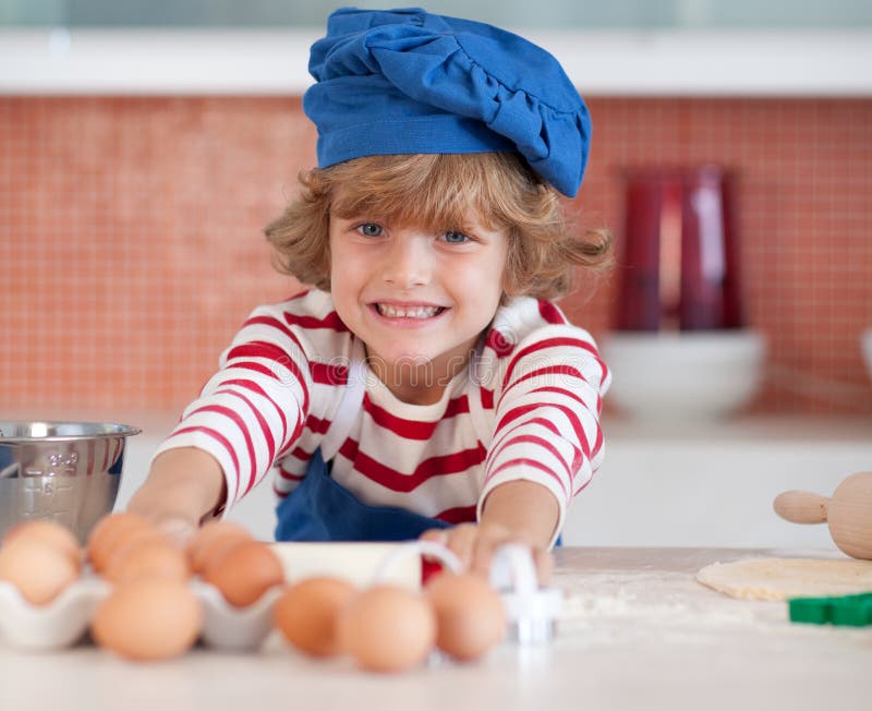 Young Boy Baking in the Kitchen Stock Photo - Image of female, daughter ...