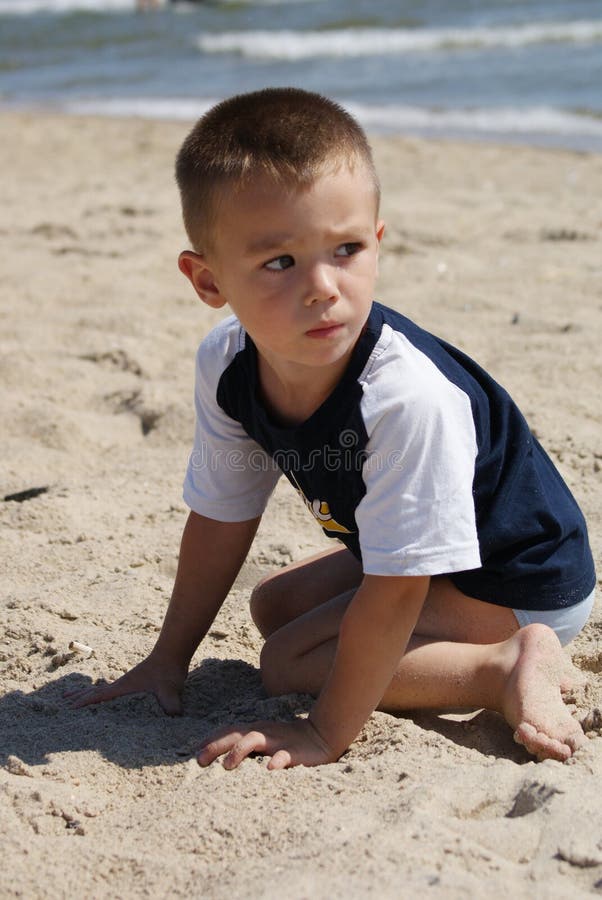 Boy at the Beach stock photo. Image of warm, steel, shovel - 6614944