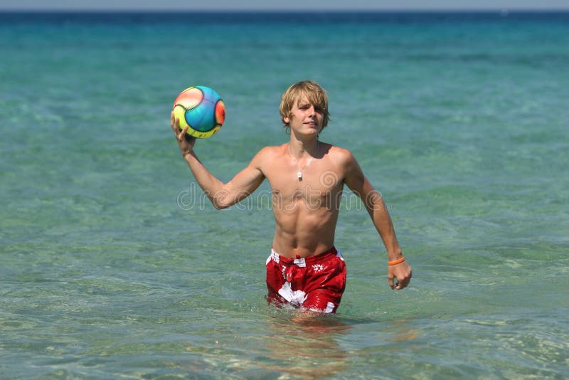 Young Boy with Beach Ball into the Sea Stock Photo - Image of people ...