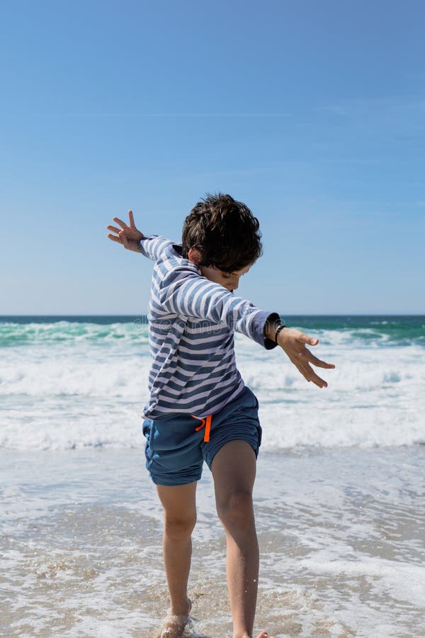 Young Boy on the Beach, by the Sea, Vertical Image Stock Photo - Image ...