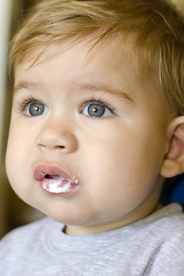 Young Boy with Beautiful Blue Eyes, Dubious Look Stock Photo - Image of ...