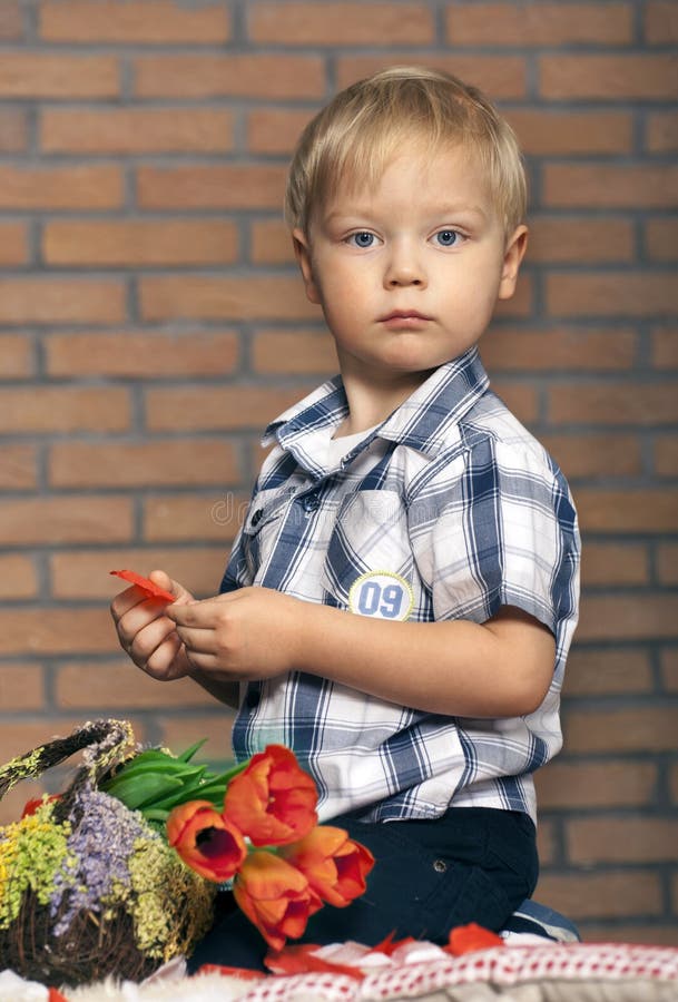 Young Boy with a Bouquet of Flowers Stock Image - Image of facial ...