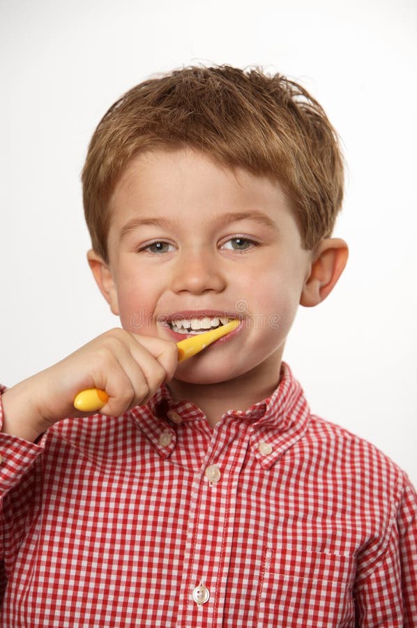Young boy brushing teeth stock image. Image of sanitary - 14388987