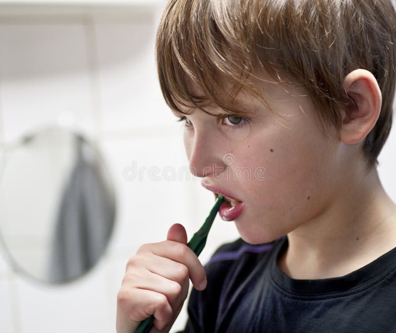 Young Boy Brushing His Teeth Stock Photo - Image of oral, dentist: 12338432