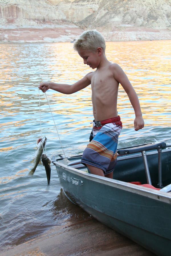 Boy and fishing trophy stock photo. Image of tackle, success - 10131934