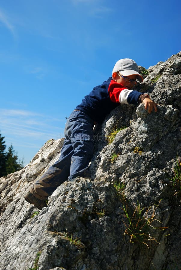 Young boy climbing stock image. Image of harness, danger - 8358737