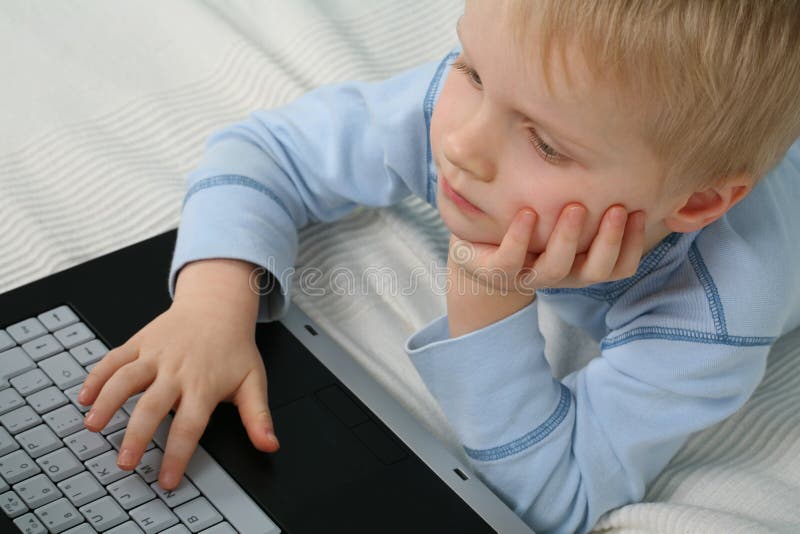 Young Boy and Computer stock image. Image of casual, blond - 1980791