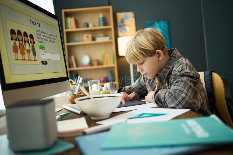 Young Boy Using Tablet while Drawing in Home Study Room Stock Image ...