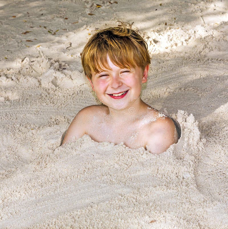 Young Boy Covered by Fine Sand at Stock Photo - Image of playful ...