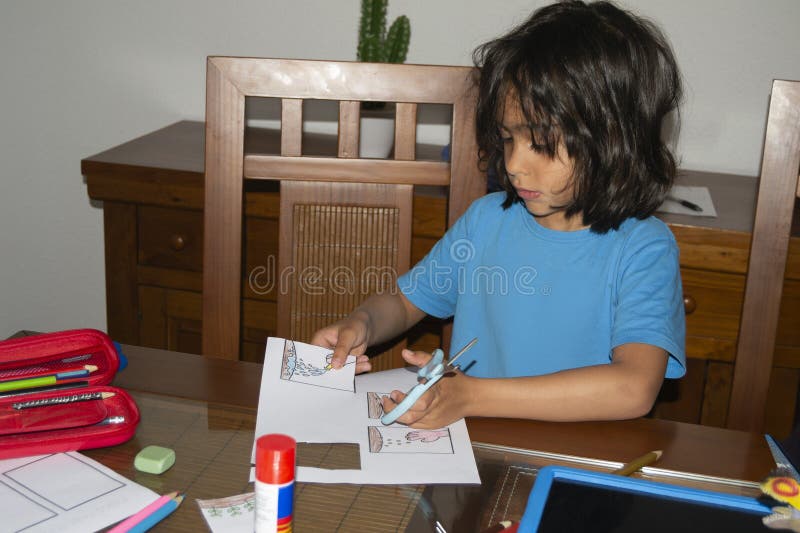 Young Boy Cutting Paper School Project Home Stock Photos - Free ...