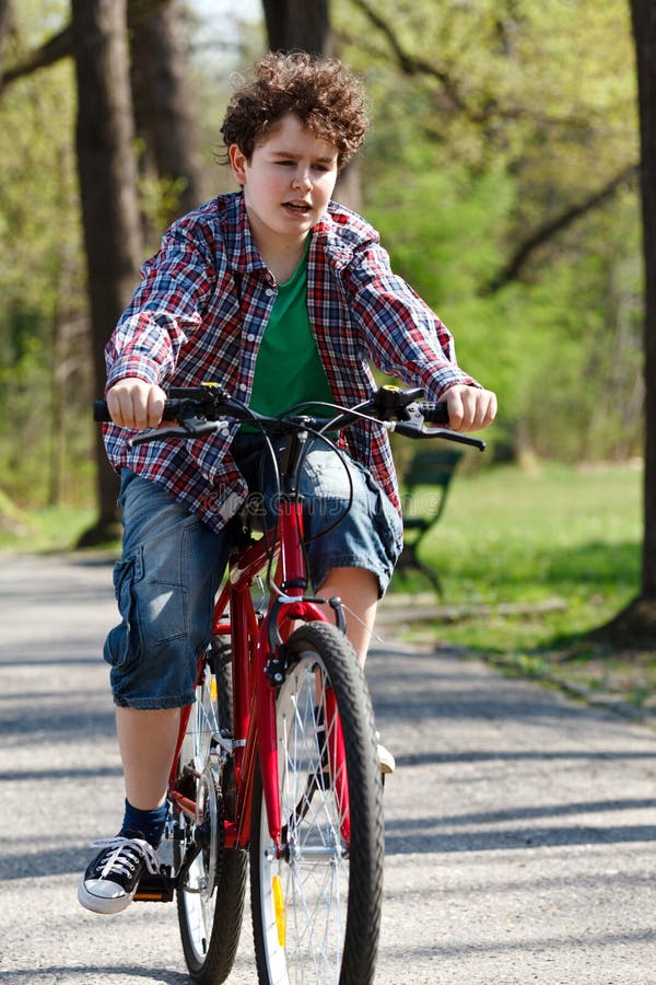 Young boy cycling stock photo. Image of cyclist, energy - 19582420