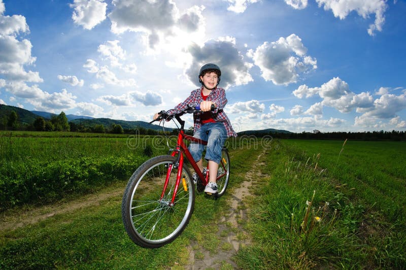 Young boy cycling stock image. Image of bicycle, male - 24304195