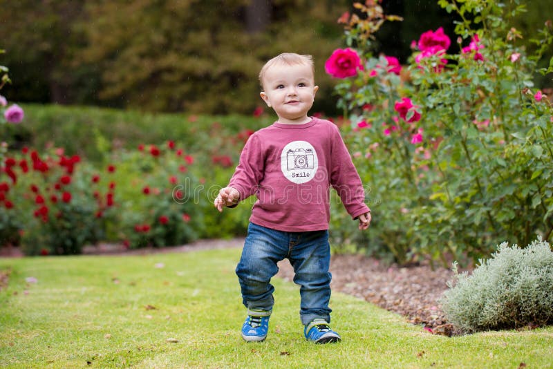A Young Boy Dancing and Singing in the Rain. Stock Image - Image of ...