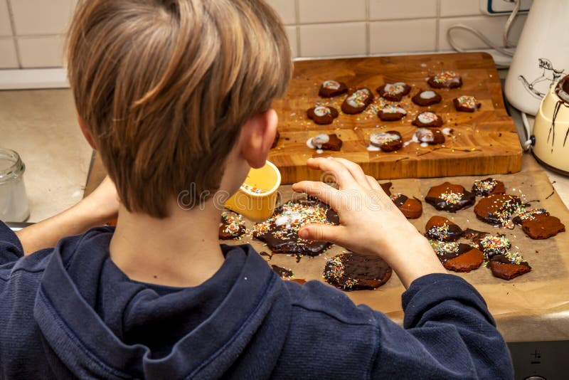 Young Boy Decorating Cookies in the Kitchen Stock Image - Image of ...