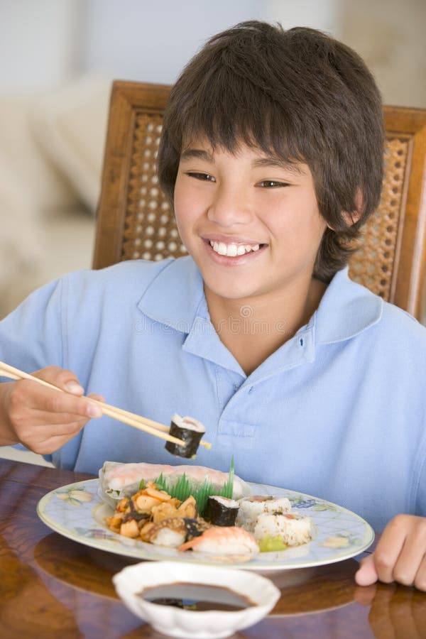 Young Boy in Dining Room Eating Chinese Food Stock Image - Image of ...